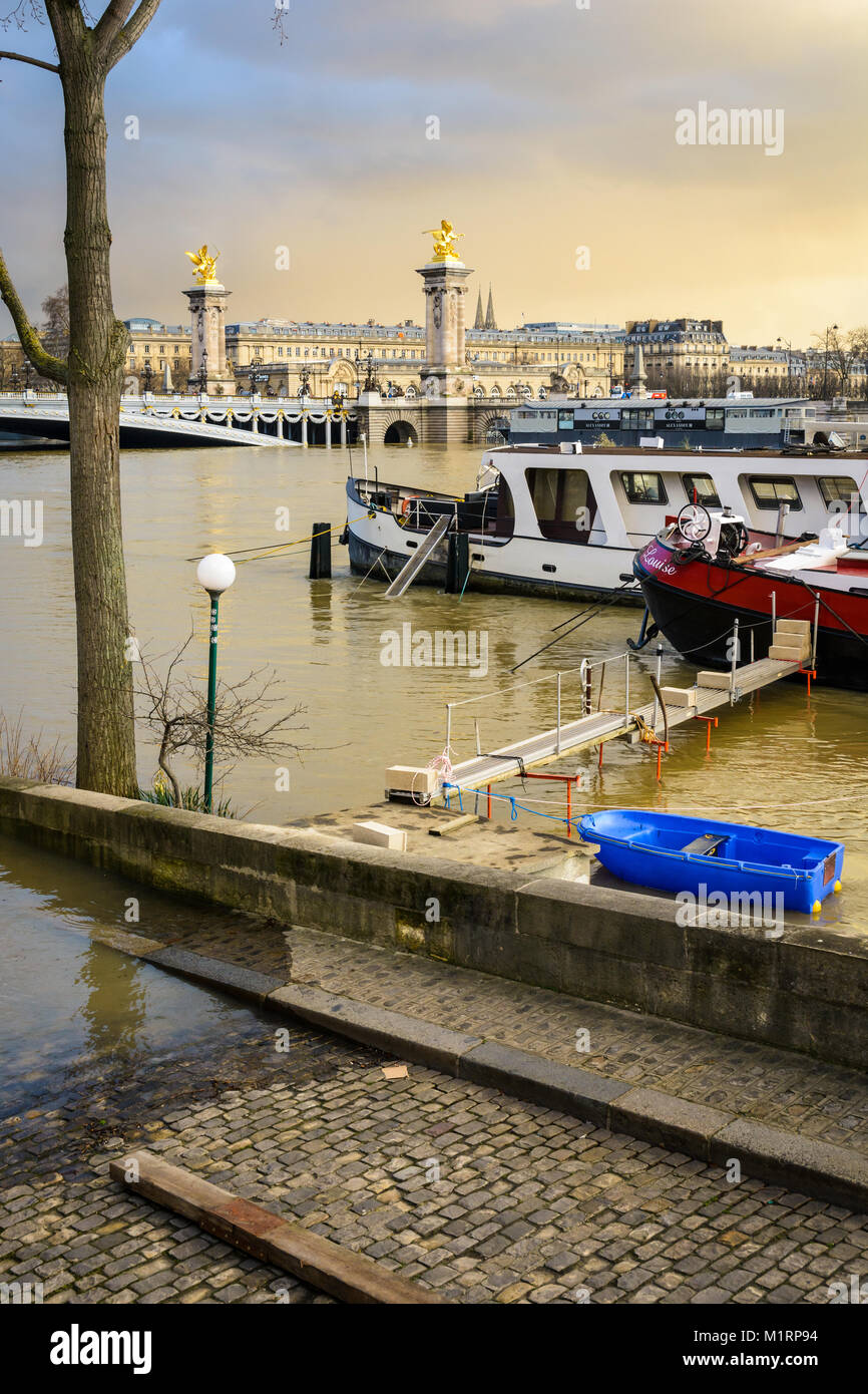 Due to the Seine in flood, people have to use a makeshift gangway to ...