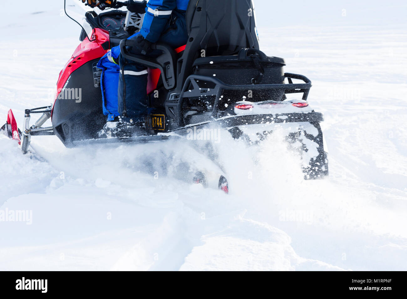Skibotn, Norway. Detail view of snowmobile flinging up snow Stock Photo ...