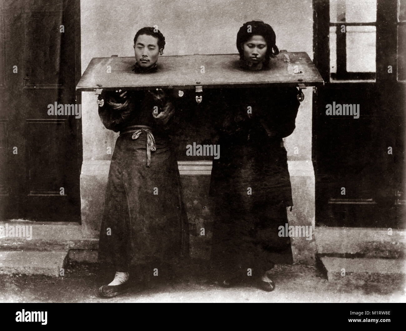 Criminals cangue hi-res stock photography and images - Alamy