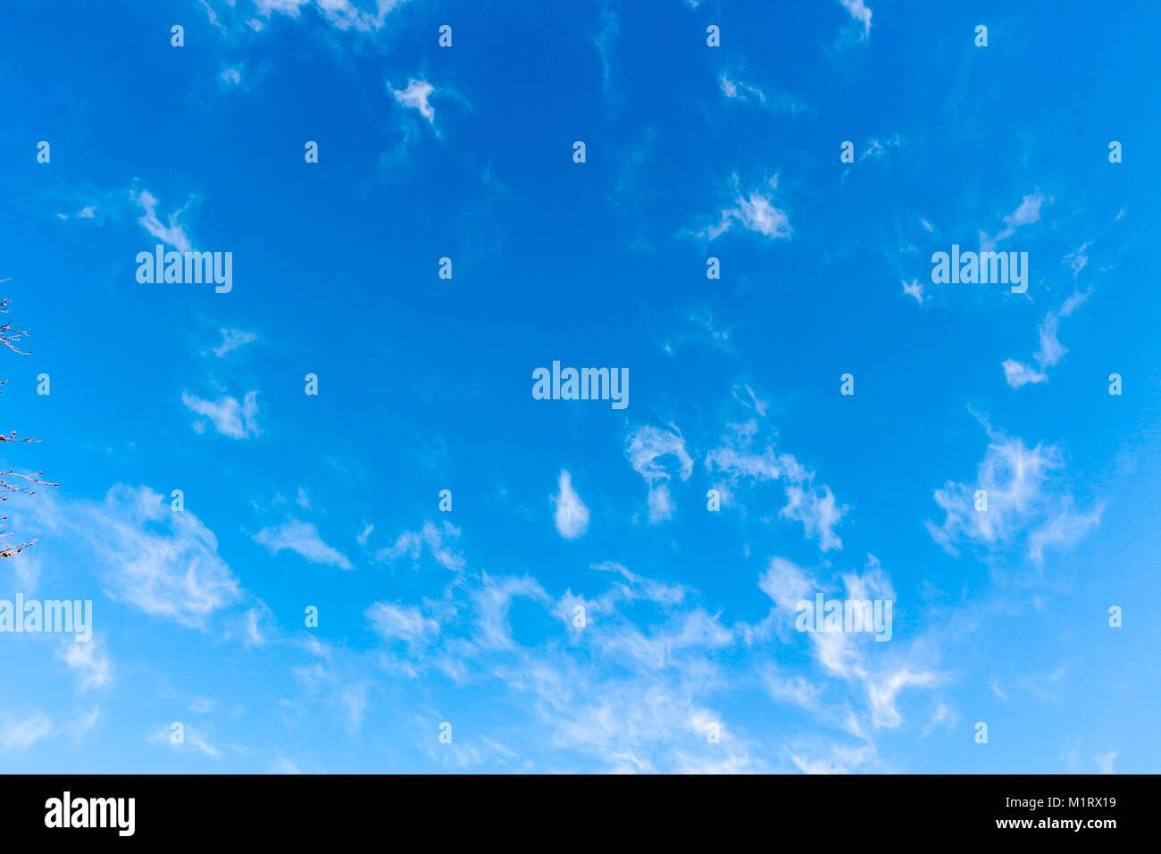 Clouds falling apart in a blue sky like smoke or spirits Stock Photo ...