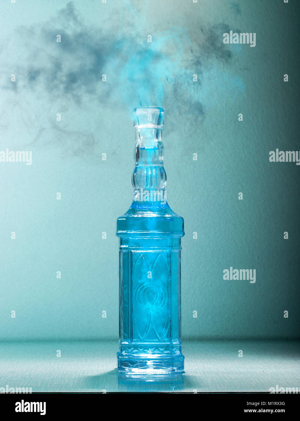 Blue magic wizards potion Stock Photo - Alamy