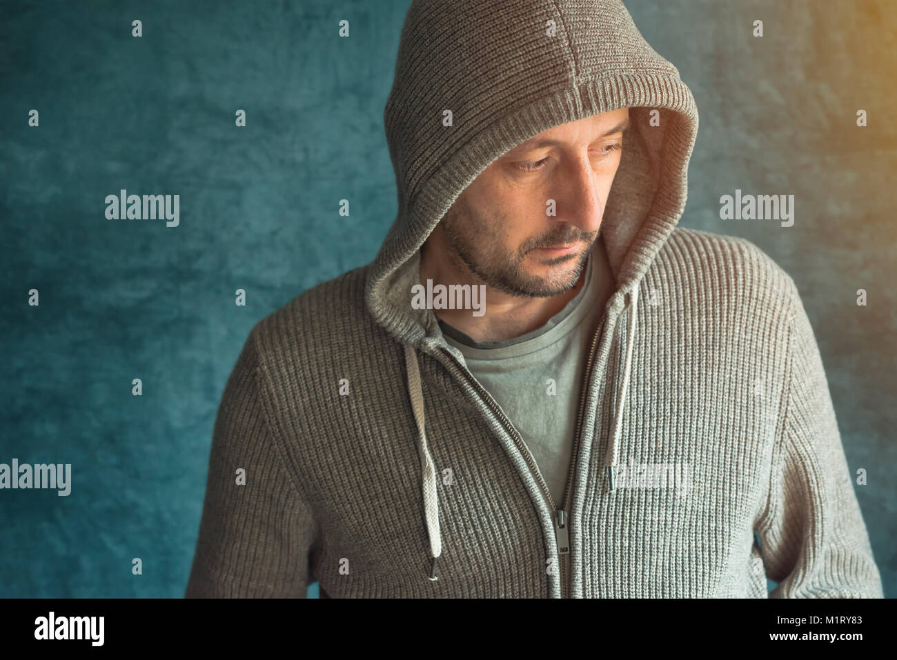 Portrait of pensive sad man looking down Stock Photo - Alamy