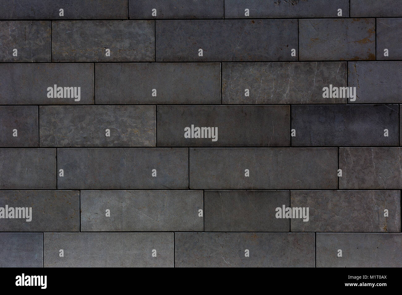 Dark stone brick background Stock Photo - Alamy