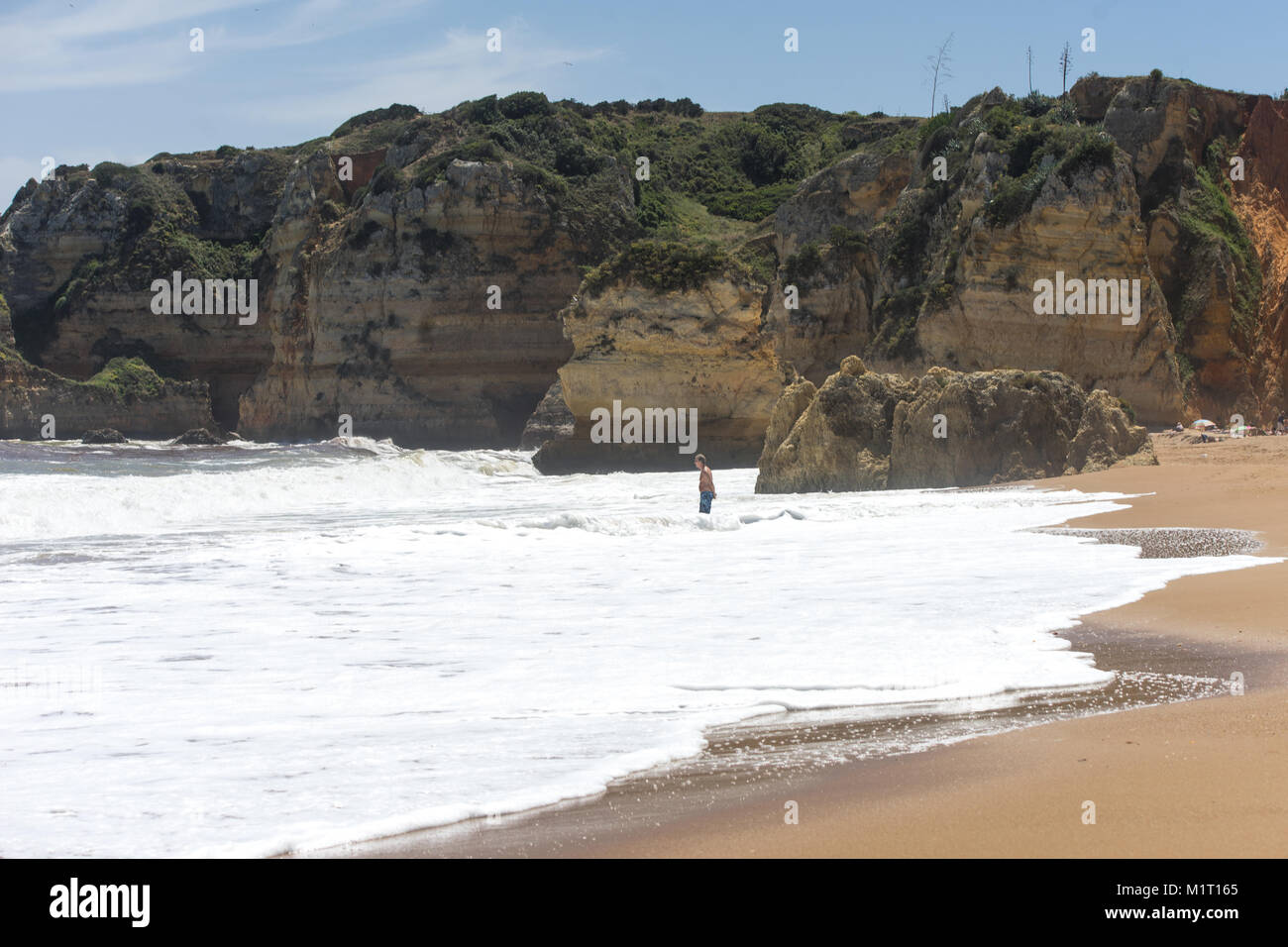 Beautiful beach with huge rocks washed by the Atlantic Ocean in the ...