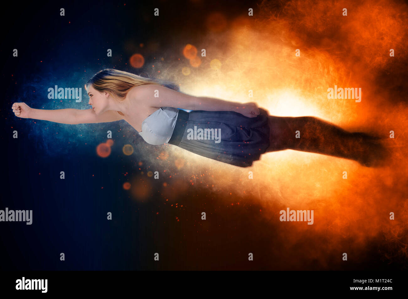 Beautiful young woman flying through the sky Stock Photo - Alamy