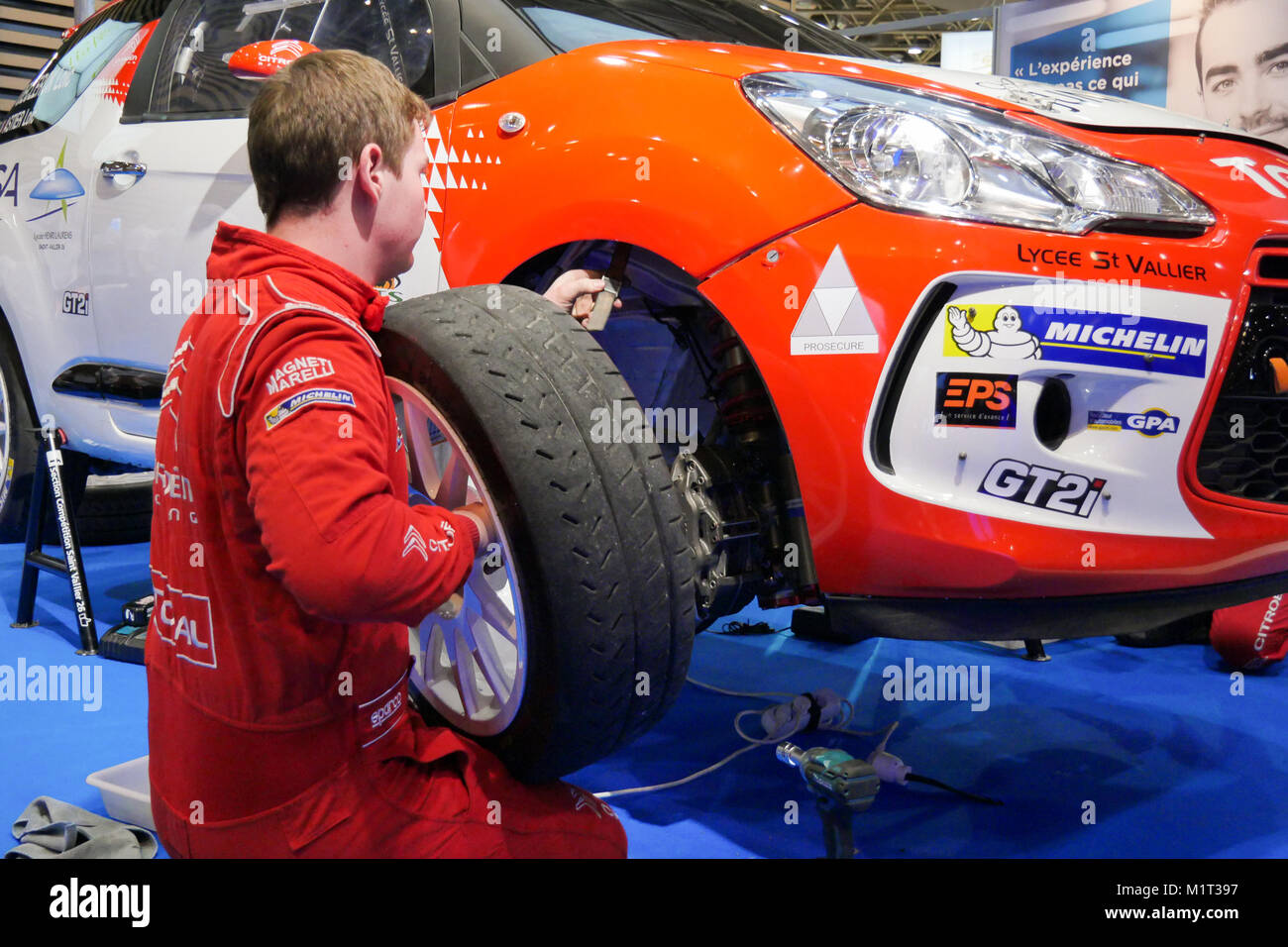 Young mechanic apprentice makes a demonstration at the "Mondial des ...