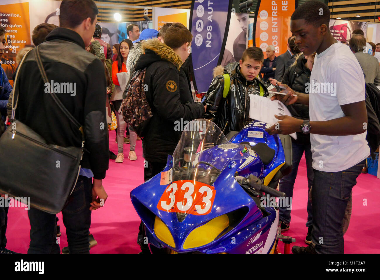 Young mechanics apprentice make a demonstration at the "Mondial des ...