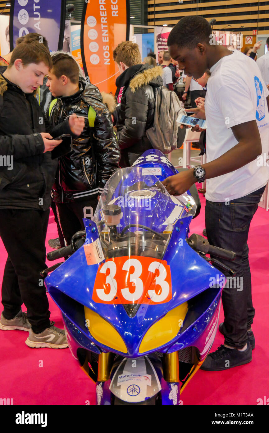 Young mechanics apprentice make a demonstration at the "Mondial des ...