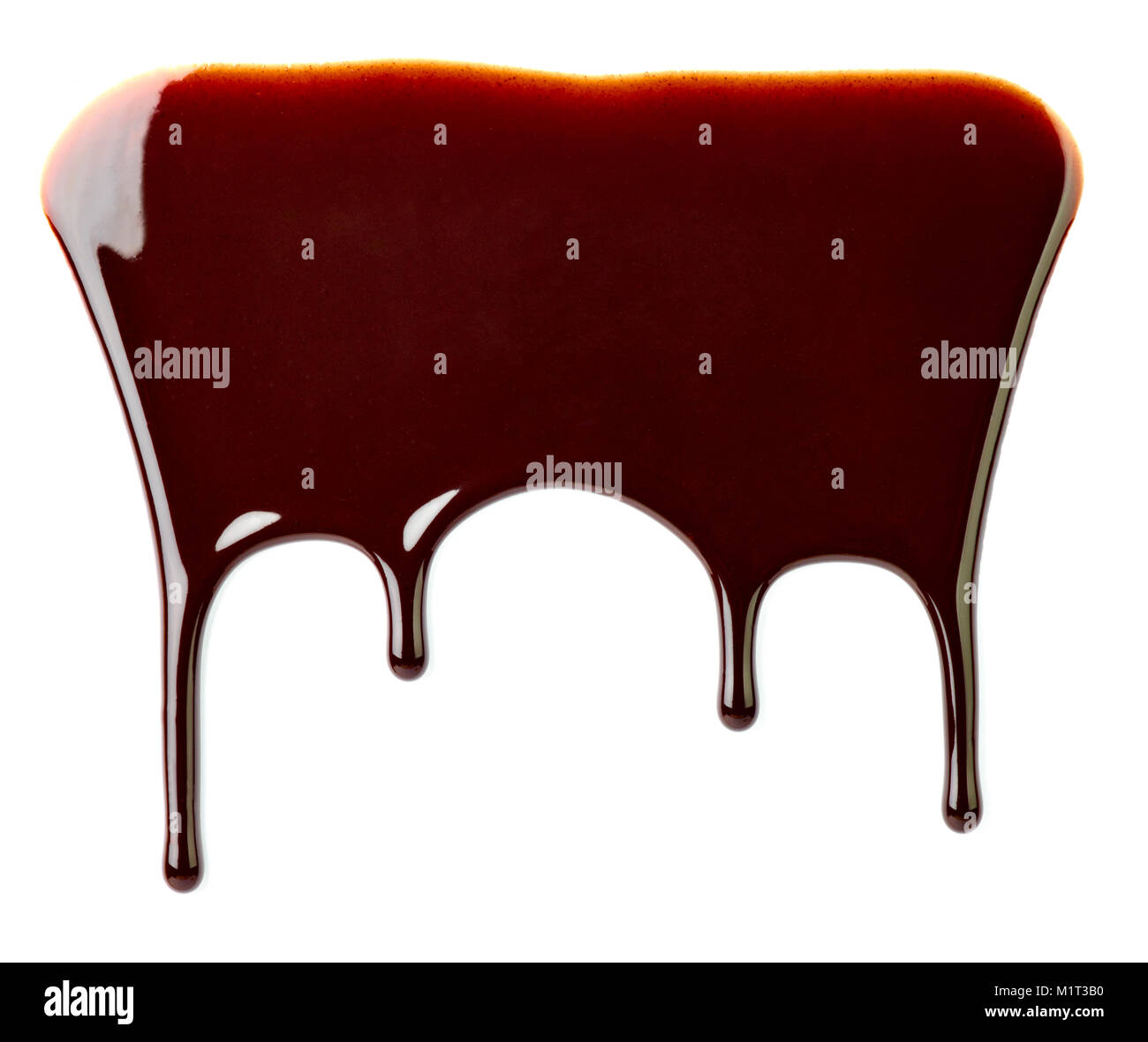 close up of chocolate syrup leaking on white background Stock Photo - Alamy