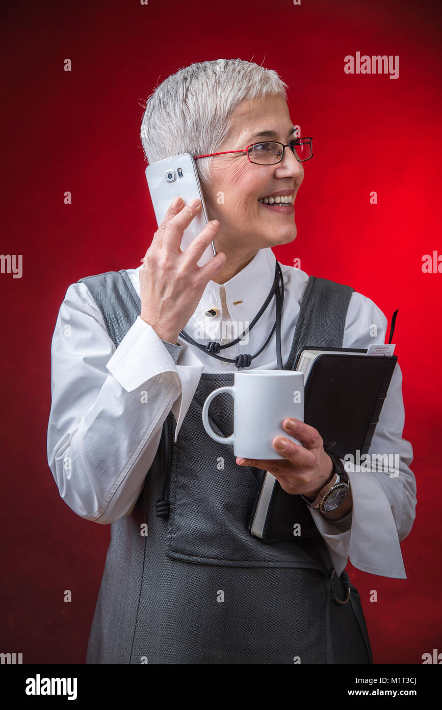 Lovely business phone call, senior female ceo Stock Photo - Alamy