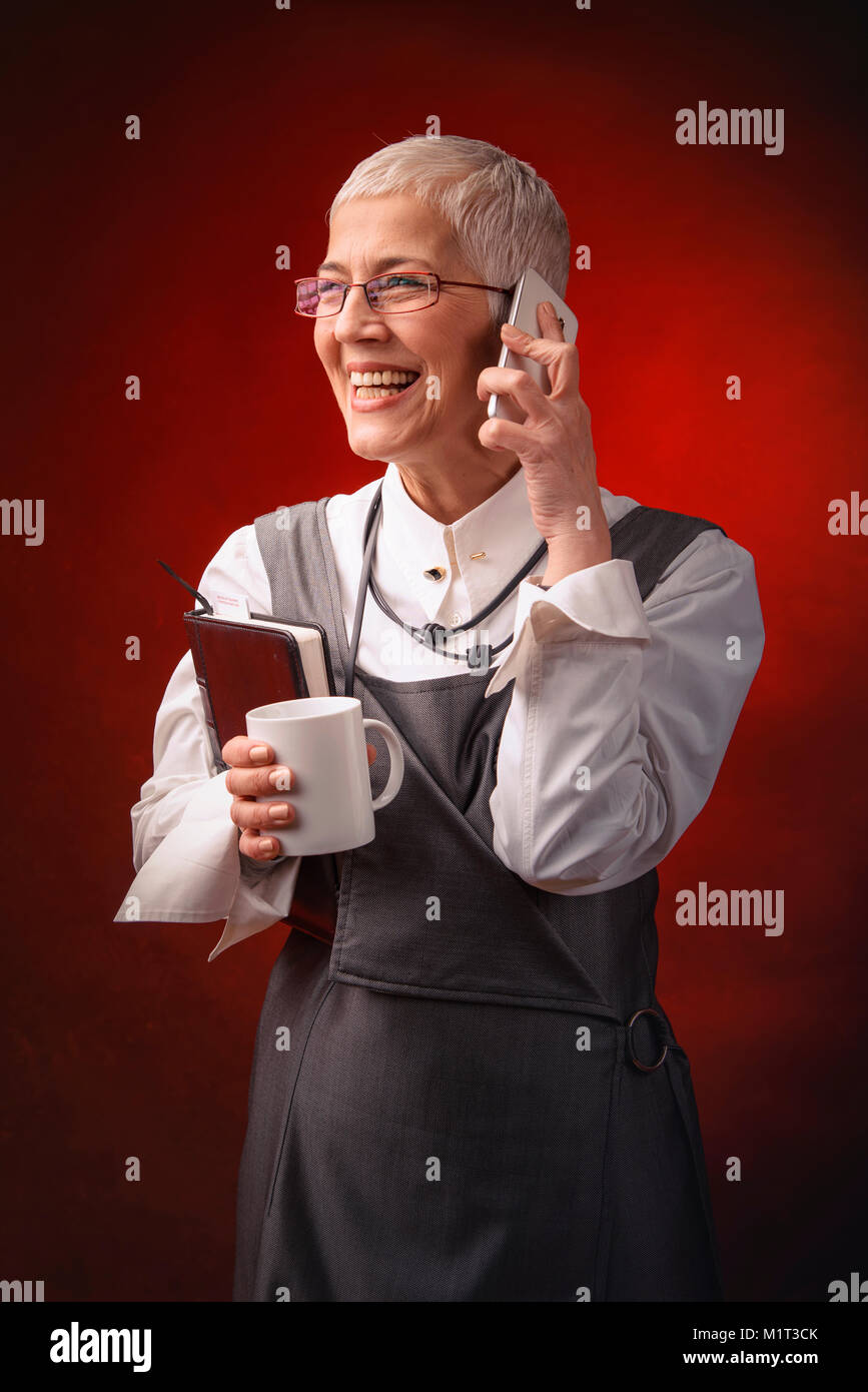 Lovely business phone call, senior female ceo Stock Photo - Alamy