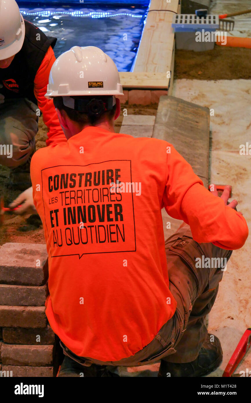 Young apprentices builders make demonstration at Job fair, Lyon, France ...