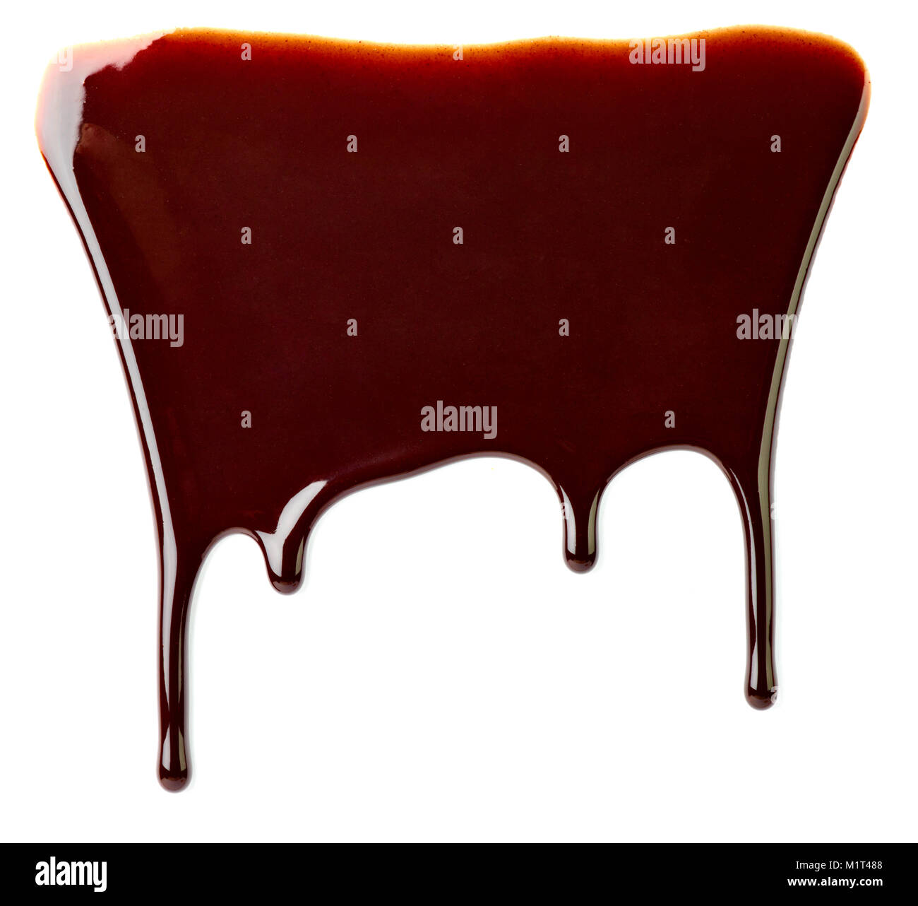 close up of chocolate syrup leaking on white background Stock Photo - Alamy