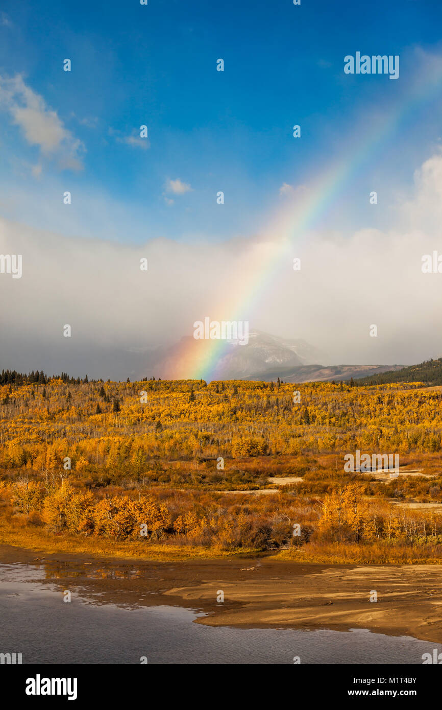 A rainbow over Glacier National Park, Montana, USA in October Stock ...