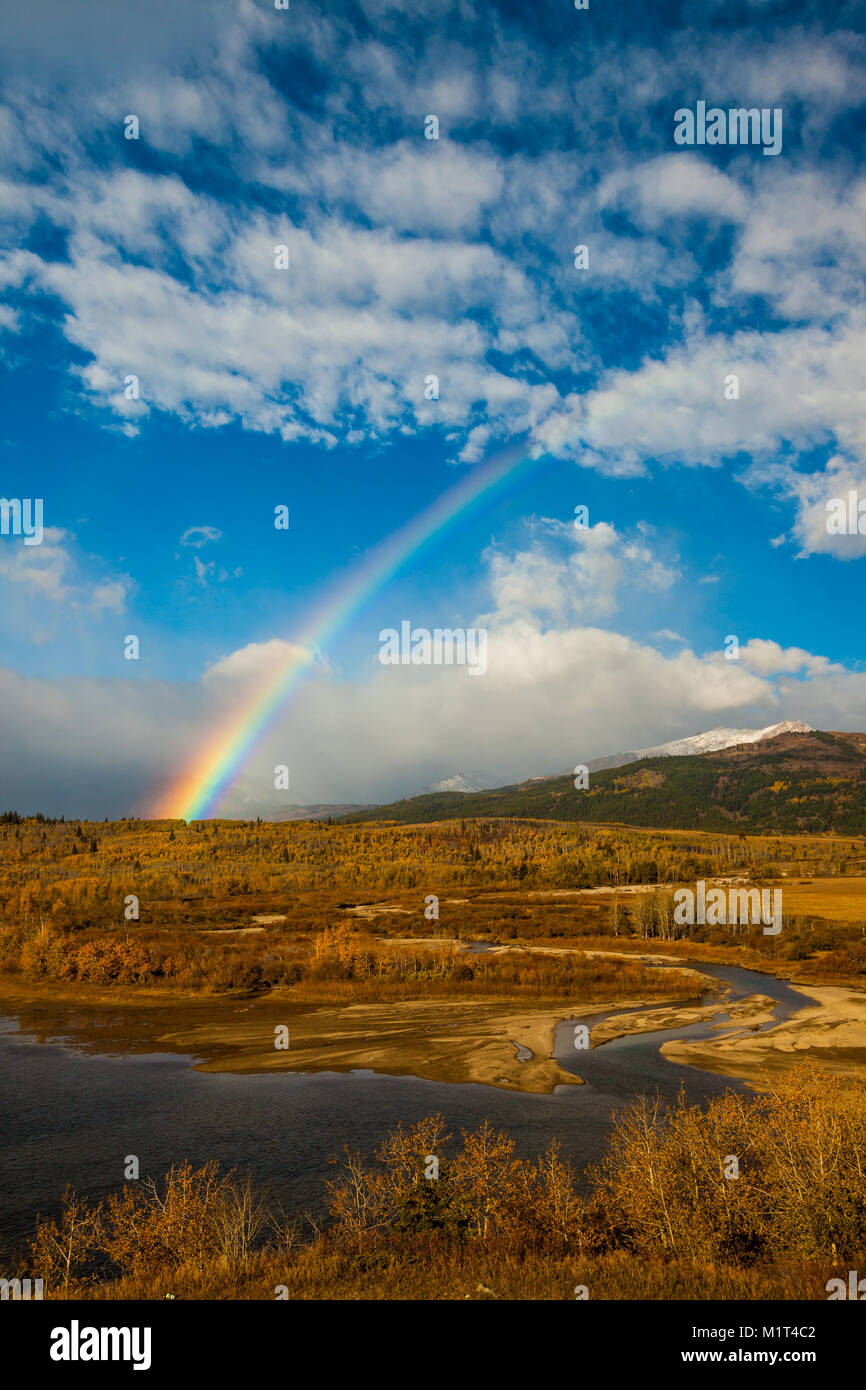 A rainbow over Glacier National Park, Montana, USA in October Stock ...
