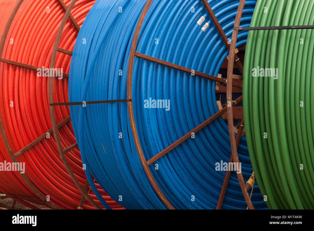 Rolls of colorful - red, green, blue, plastic pipes or tubes Stock ...