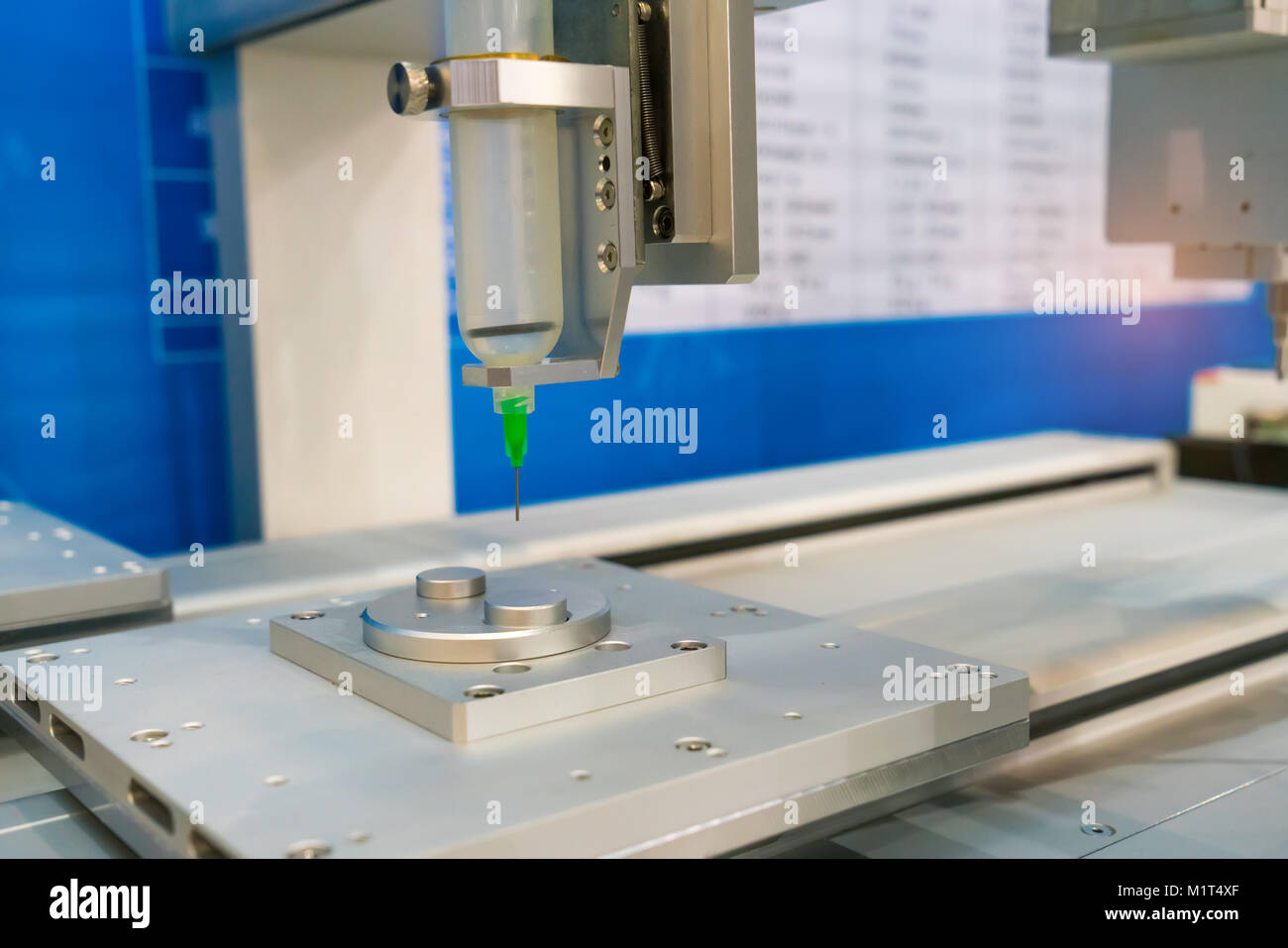 Robot holding glue syringe Injection Stock Photo - Alamy