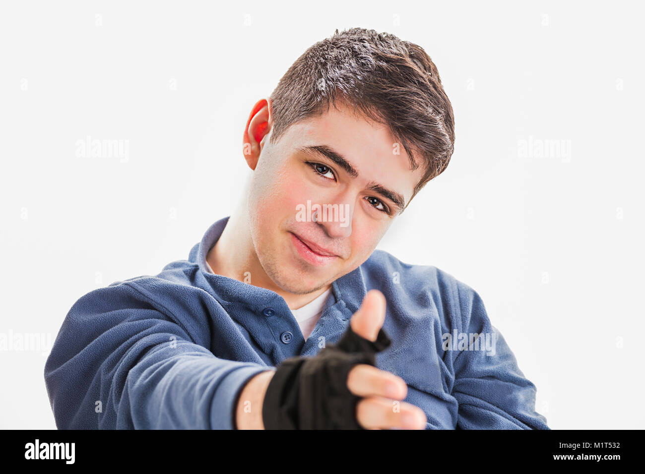 closeup of smiling teenage boy isolated on white background handing ...