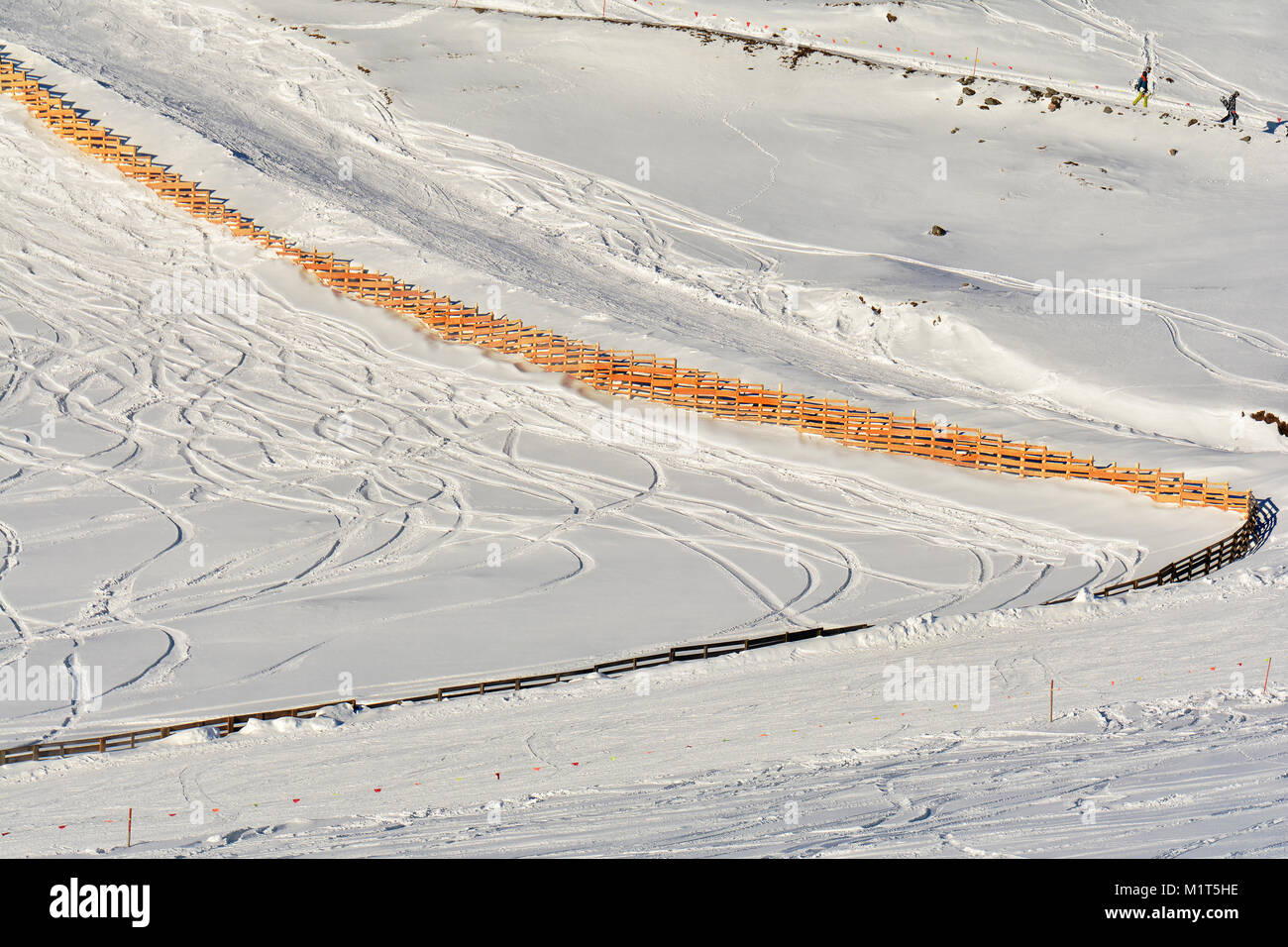 Beautiful evening winter view at 2000m altitude with traces slope in ...
