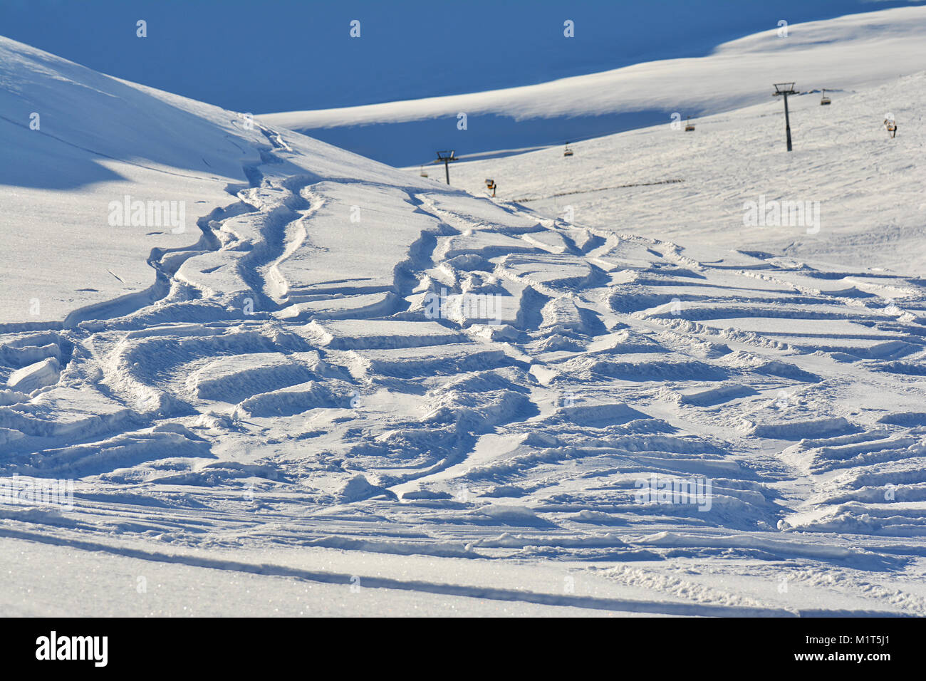 Beautiful evening winter view at 2000m altitude with traces slope in ...