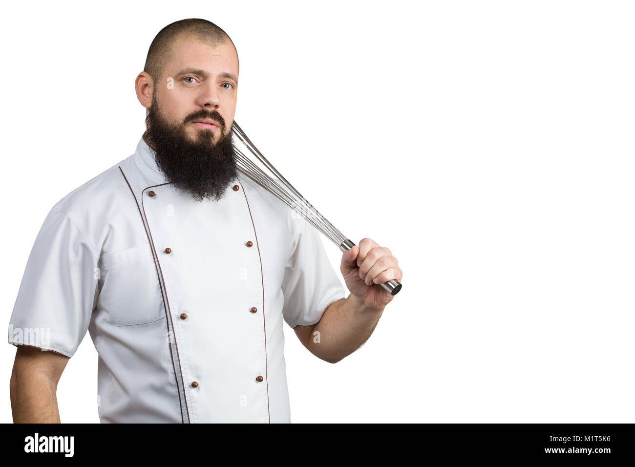 Handsome cook man wearing chef uniform holding hand mixer or wire whisk ...