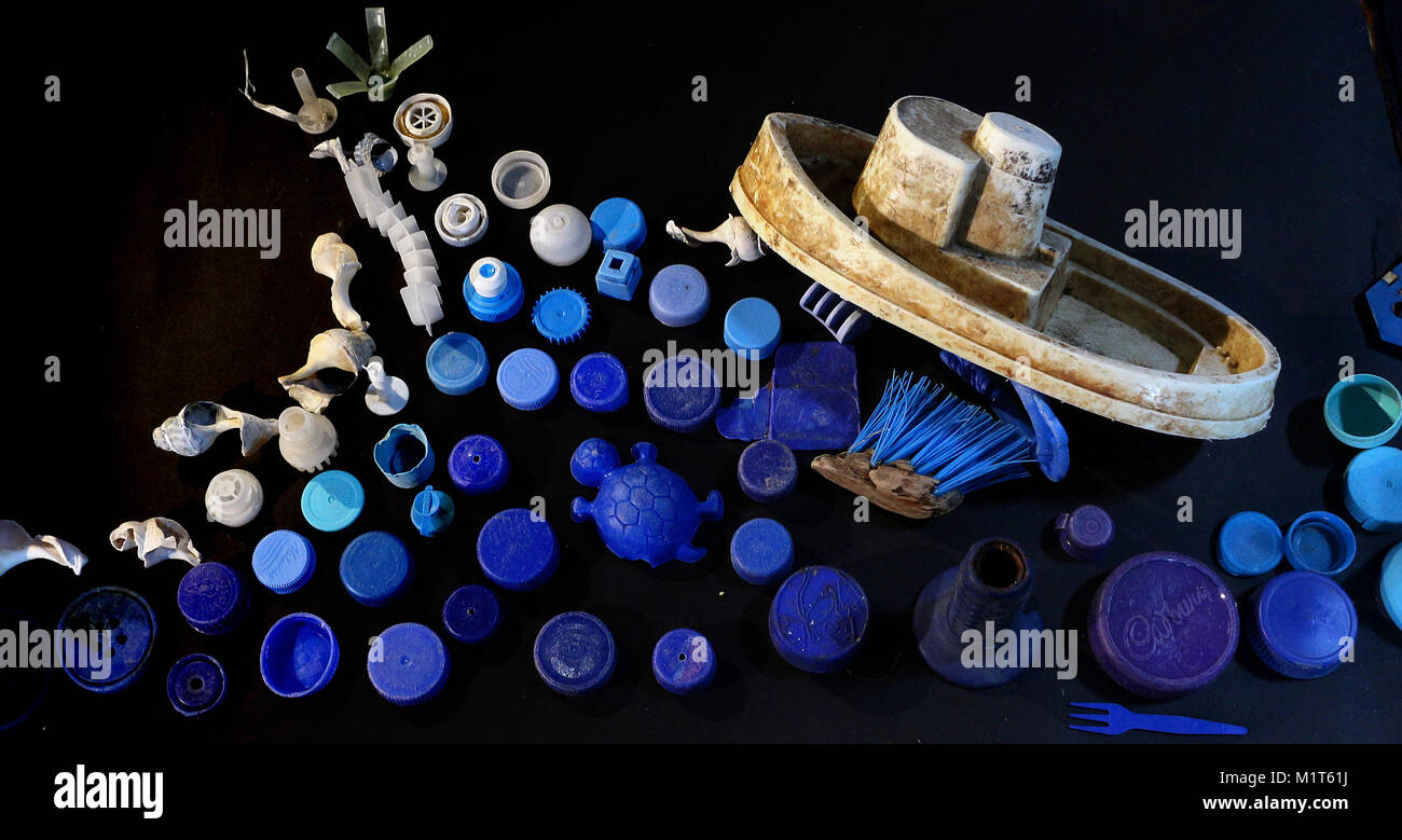 A toy boat sails the heaving sea of plastic trash Stock Photo - Alamy
