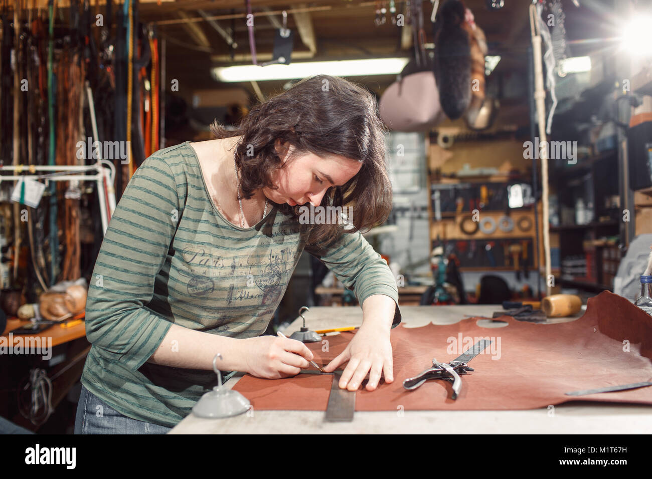 Working process in the leather workshop Stock Photo - Alamy