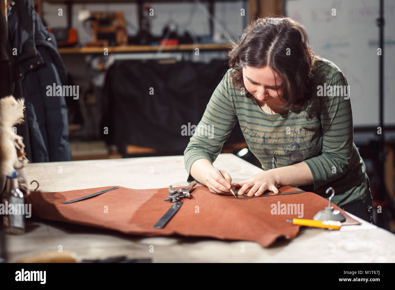 Working process in the leather workshop Stock Photo - Alamy