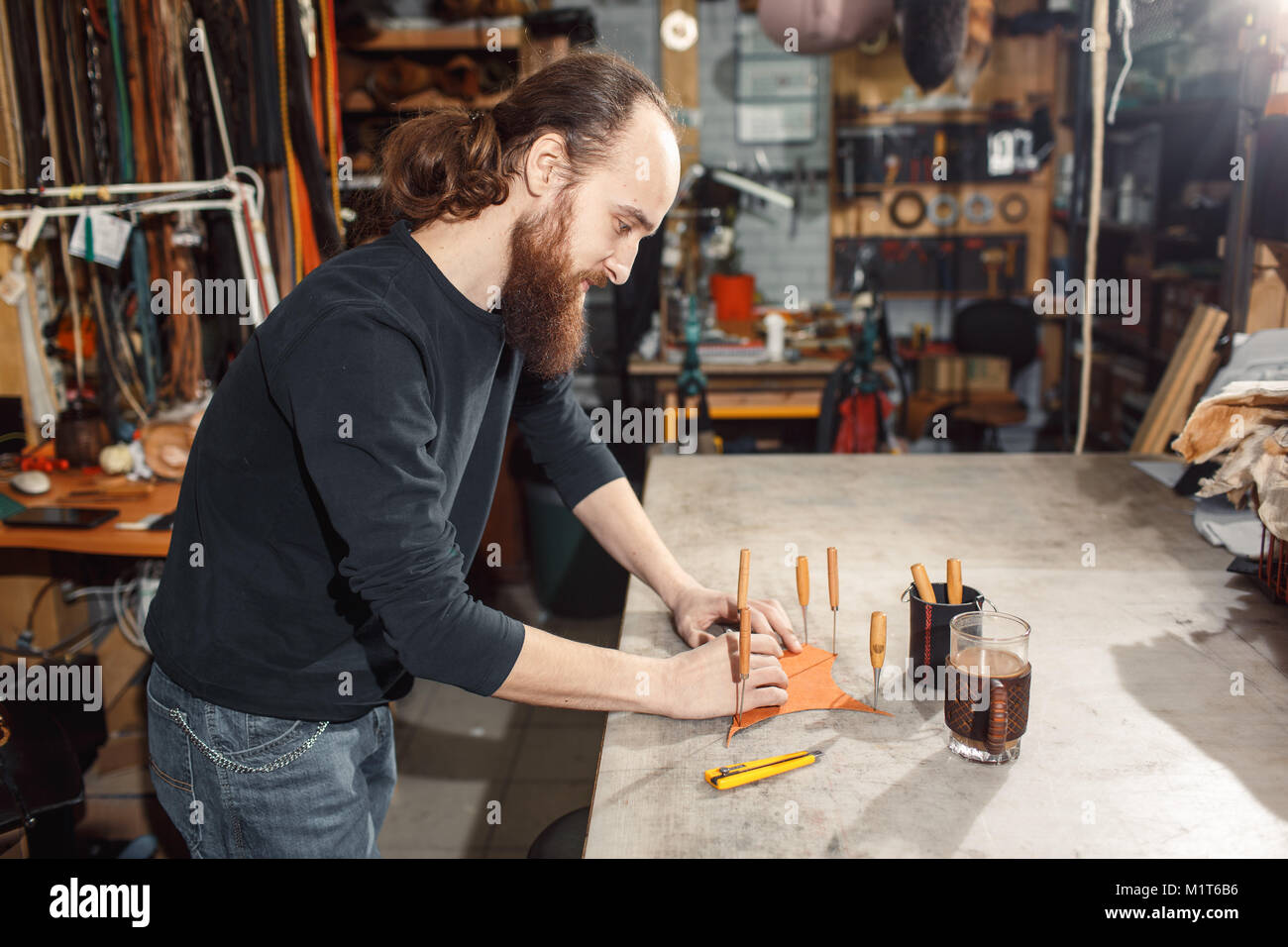 Working process in the leather workshop. Tanner in old tannery Stock ...