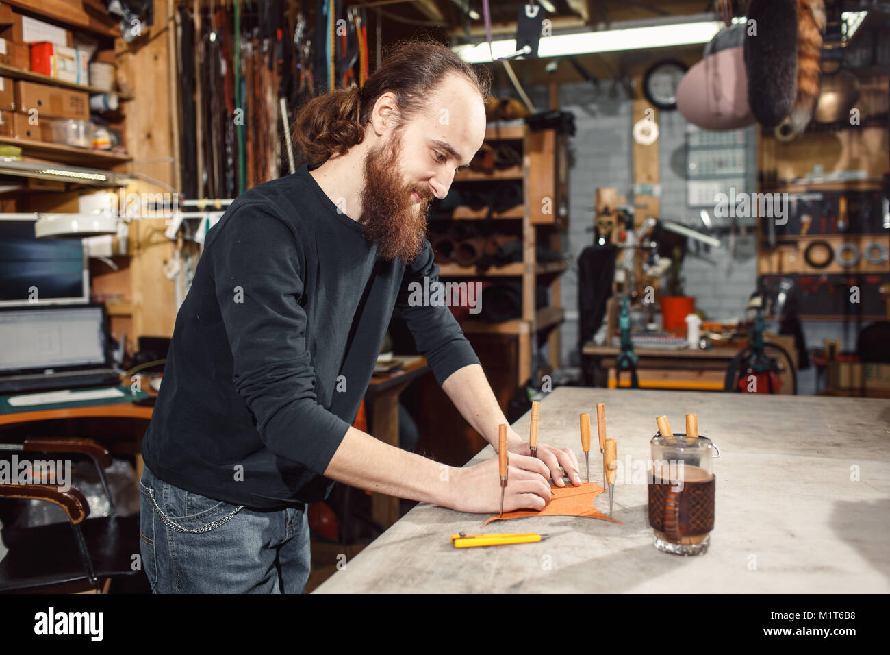 Working process in the leather workshop. Tanner in old tannery Stock ...