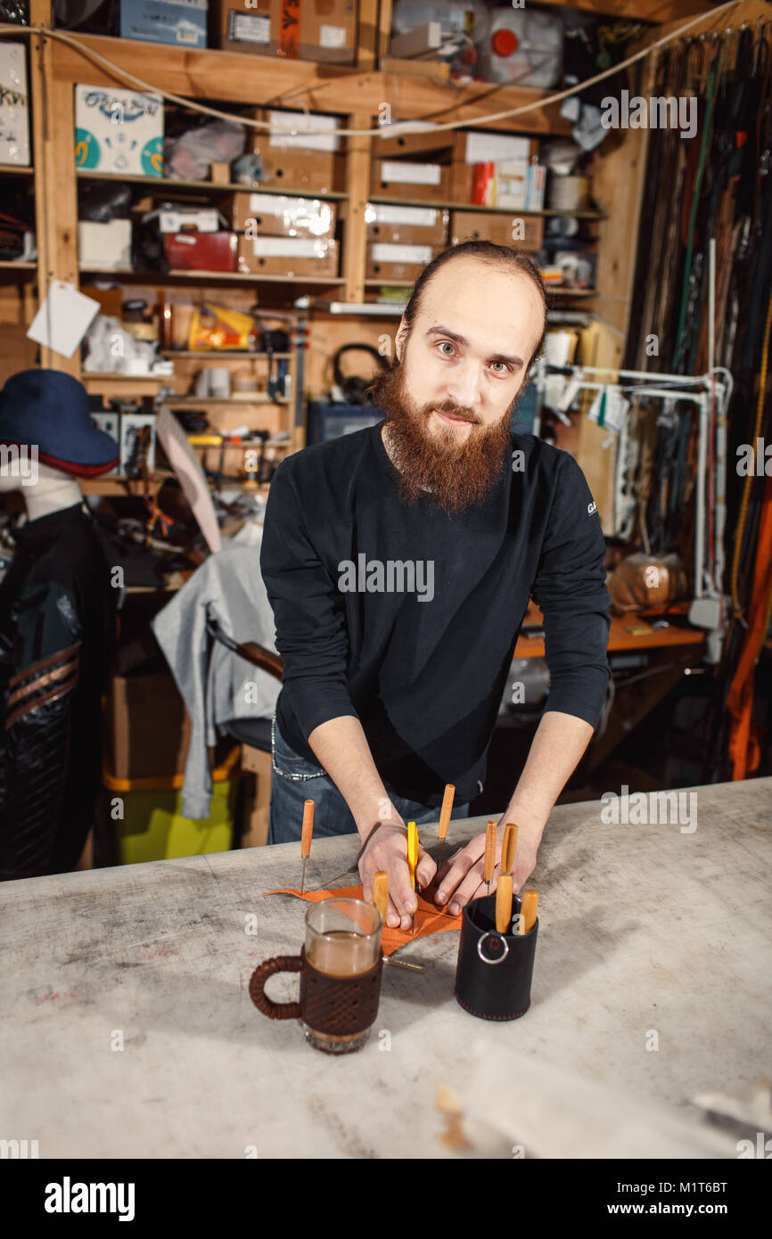 Working process in the leather workshop. Tanner in old tannery Stock ...