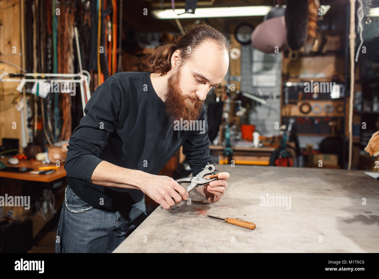 Working process in the leather workshop. Tanner in old tannery Stock ...