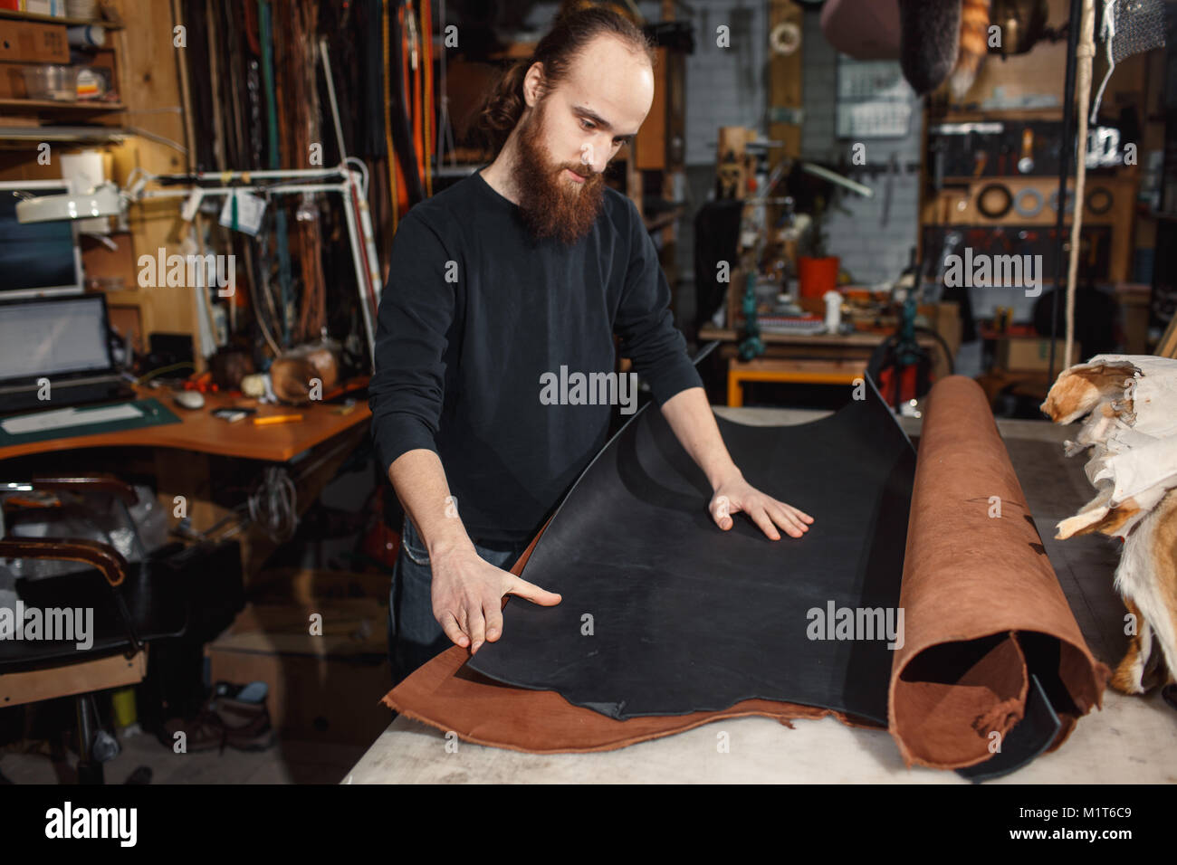 Working process in the leather workshop. Tanner in old tannery Stock ...