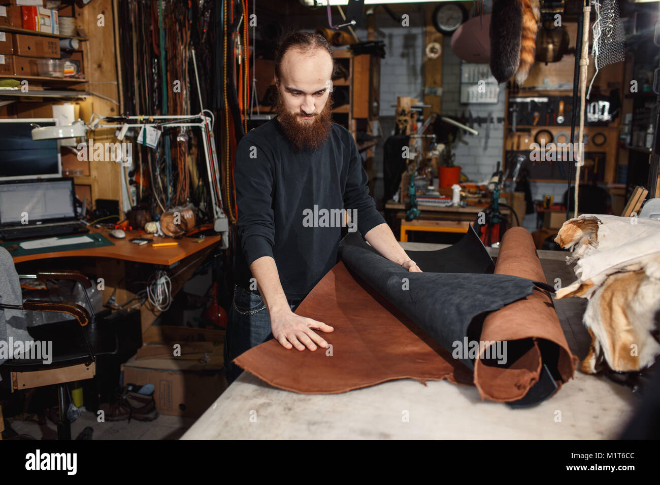 Working process in the leather workshop. Tanner in old tannery Stock ...