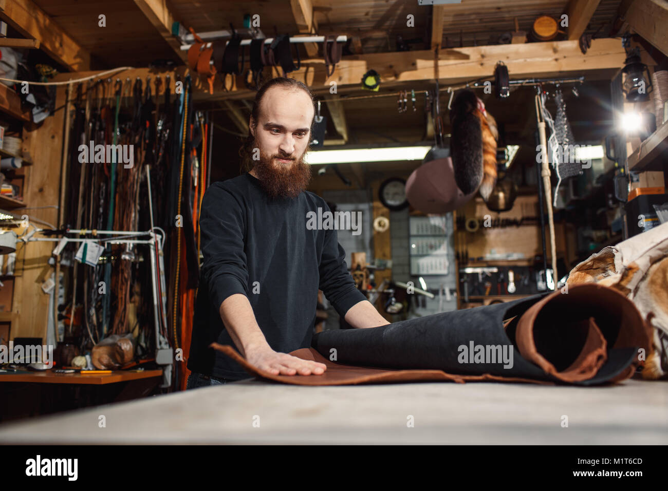 Working process in the leather workshop. Tanner in old tannery Stock ...