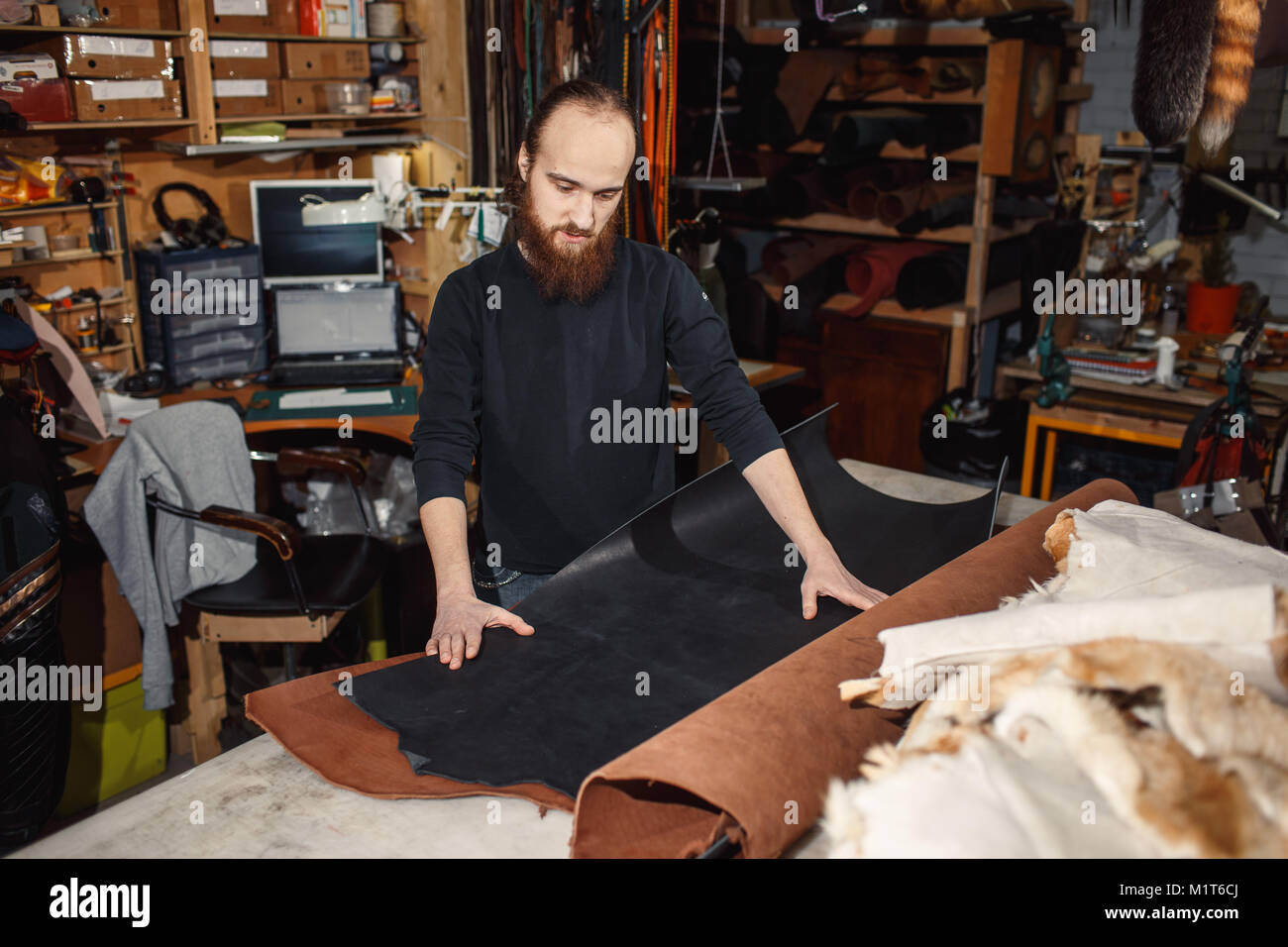 Working process in the leather workshop. Tanner in old tannery Stock ...