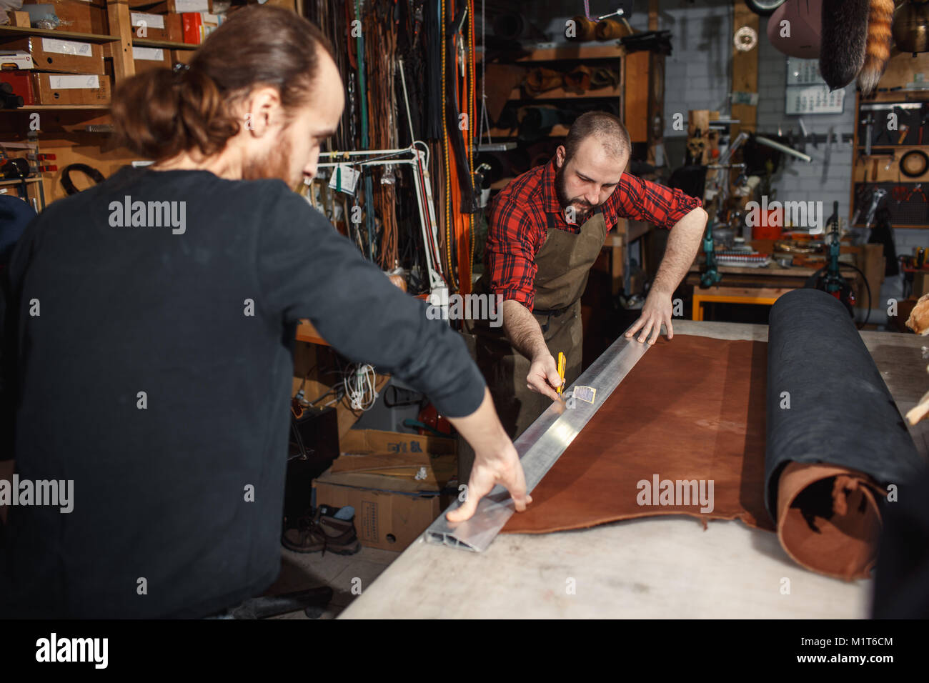 Working process in the leather workshop. Tanner in old tannery Stock ...
