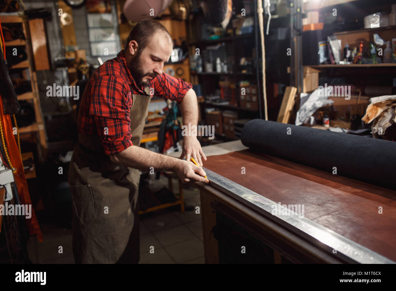 Working process in the leather workshop. Tanner in old tannery Stock ...