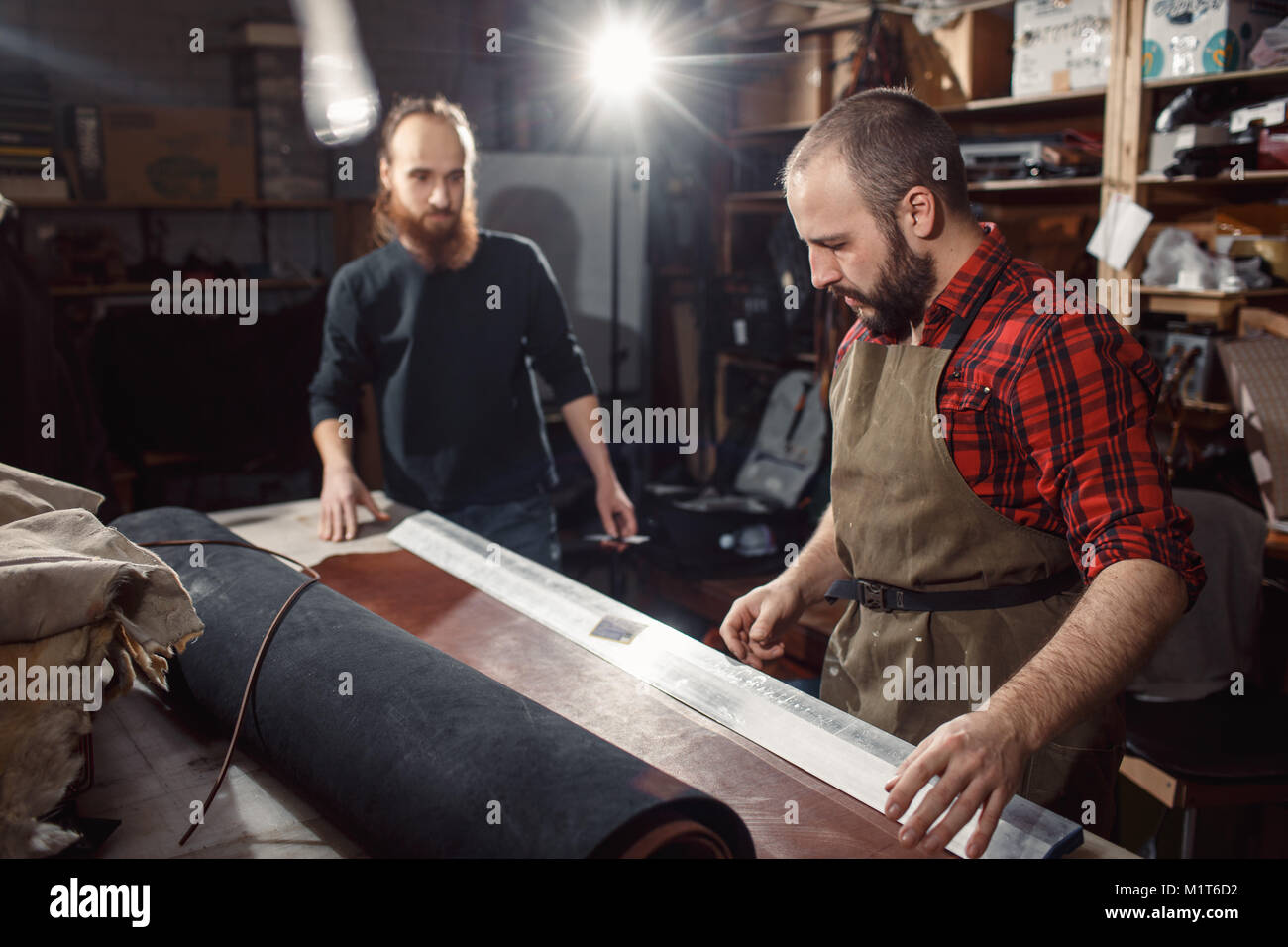 Working process in the leather workshop. Tanner in old tannery Stock ...