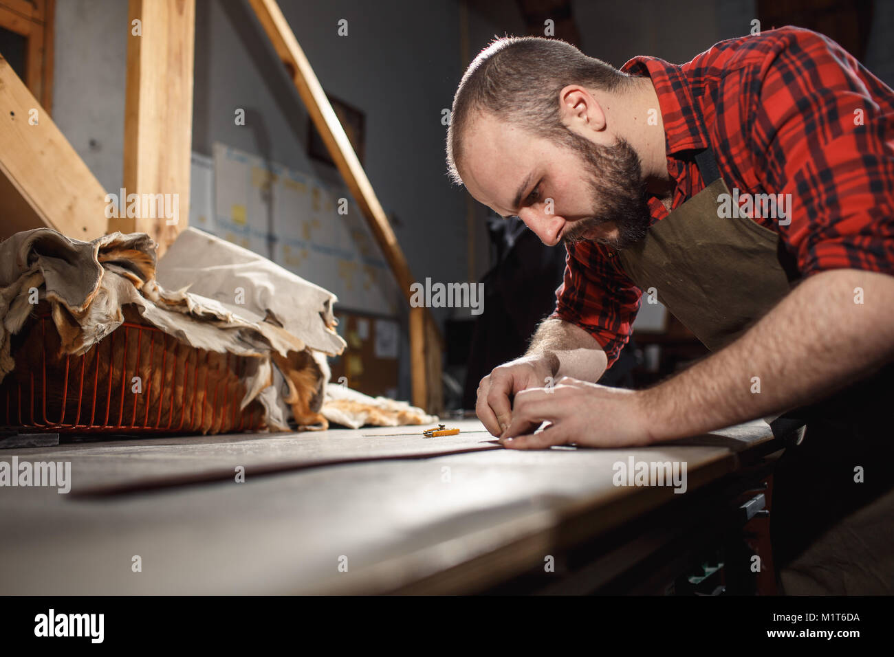 Working process in the leather workshop. Tanner in old tannery Stock ...