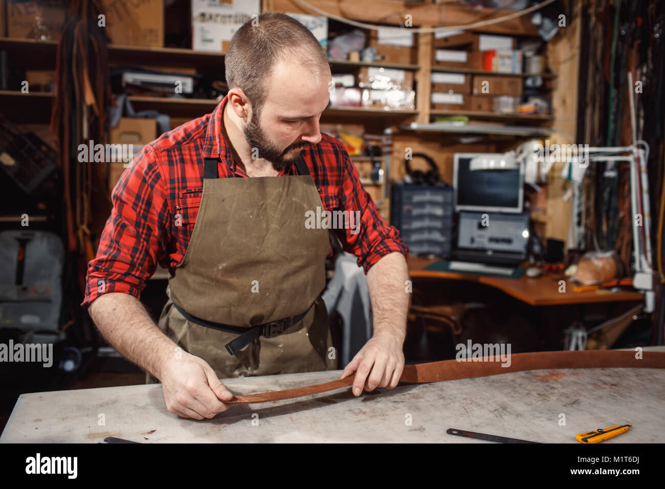 Working process in the leather workshop. Tanner in old tannery Stock ...