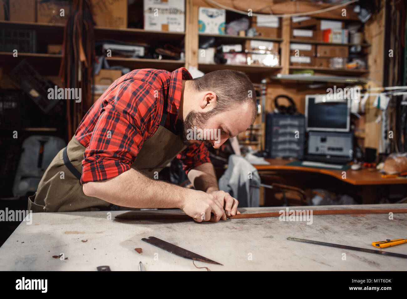 Working process in the leather workshop. Tanner in old tannery Stock ...