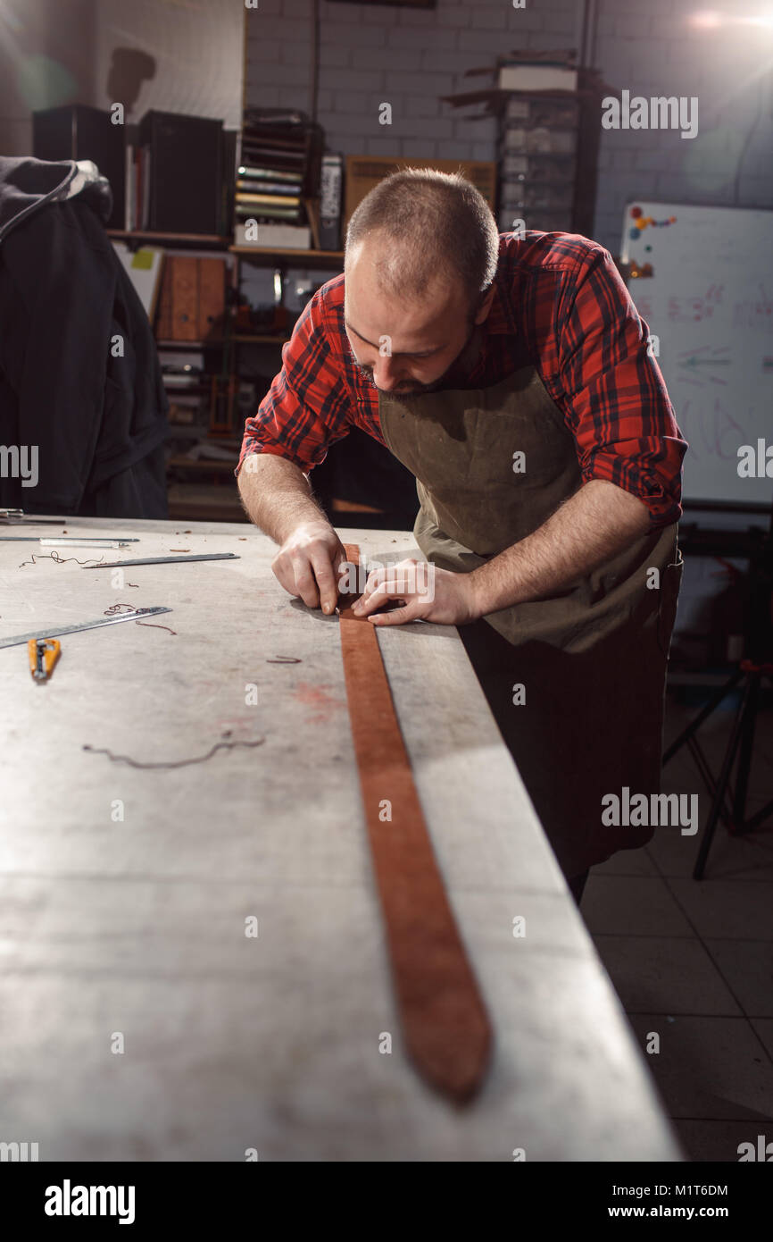 Working process in the leather workshop. Tanner in old tannery Stock ...