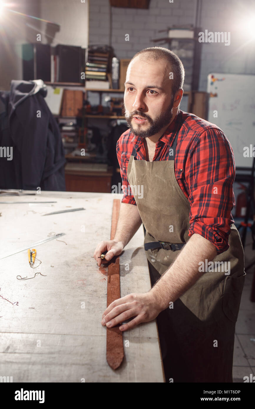 Working process in the leather workshop. Tanner in old tannery Stock ...