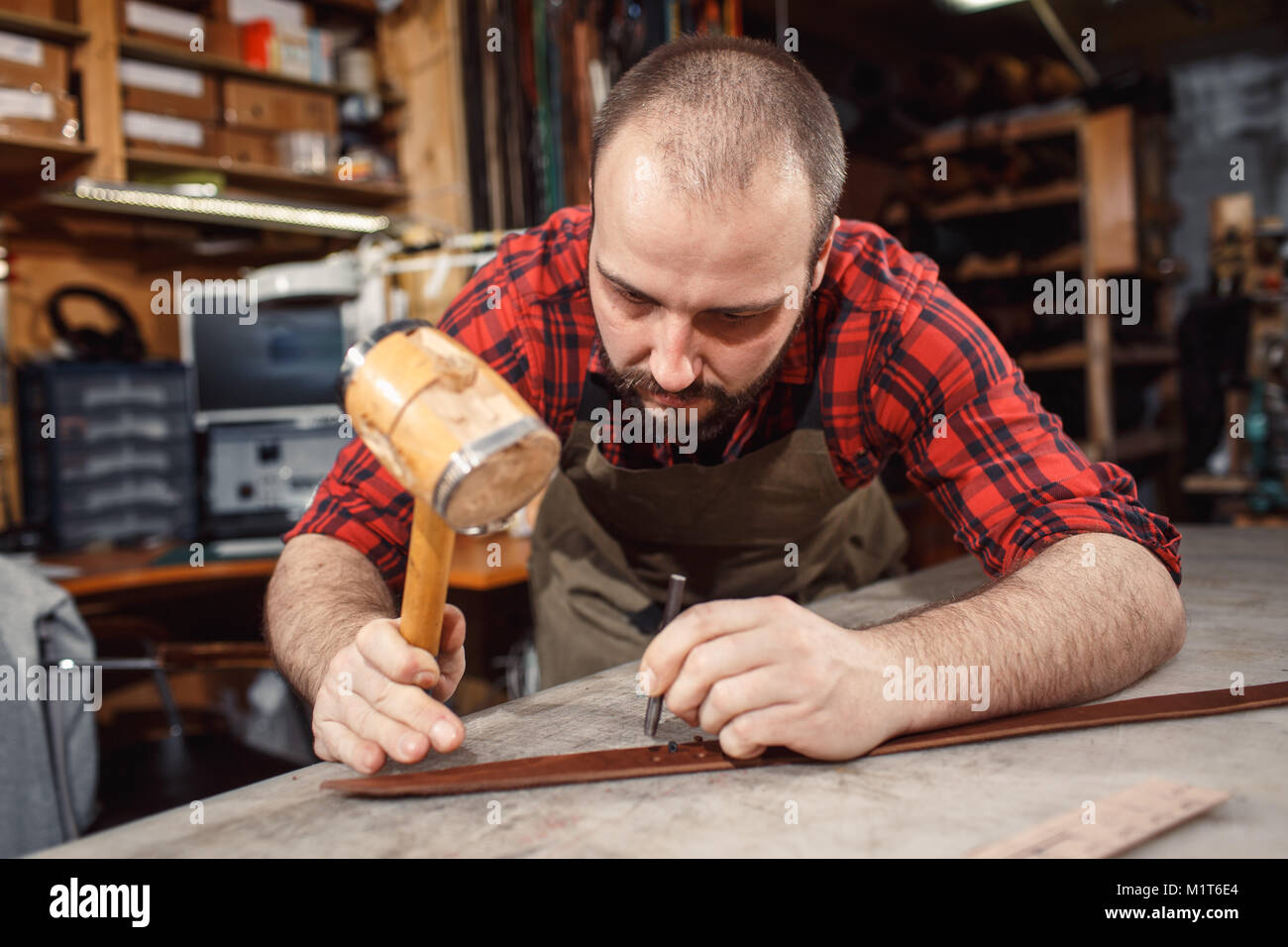 Working process in the leather workshop. Tanner in old tannery Stock ...