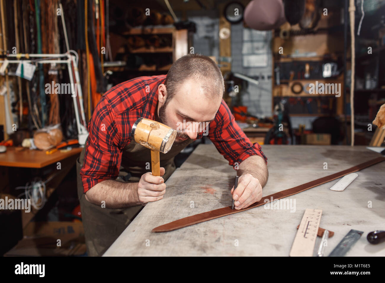 Working process in the leather workshop. Tanner in old tannery Stock ...