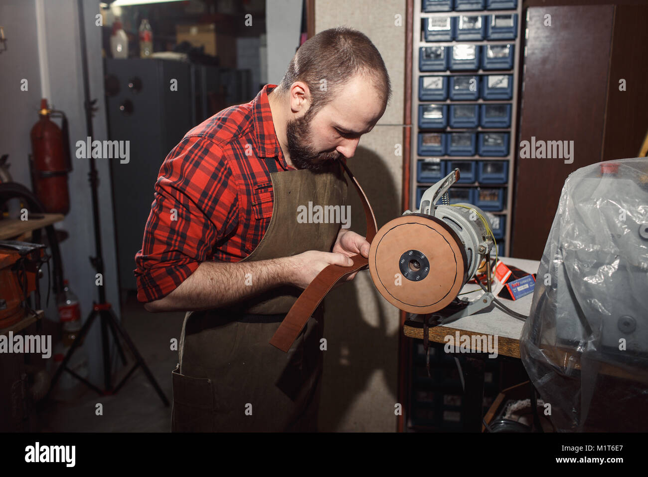 Working process in the leather workshop. Tanner in old tannery Stock ...