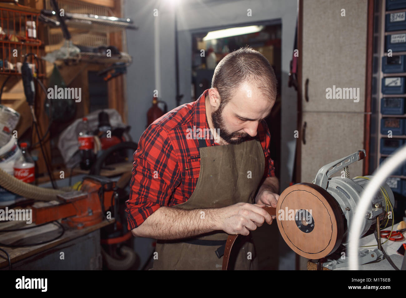 Working process in the leather workshop. Tanner in old tannery Stock ...