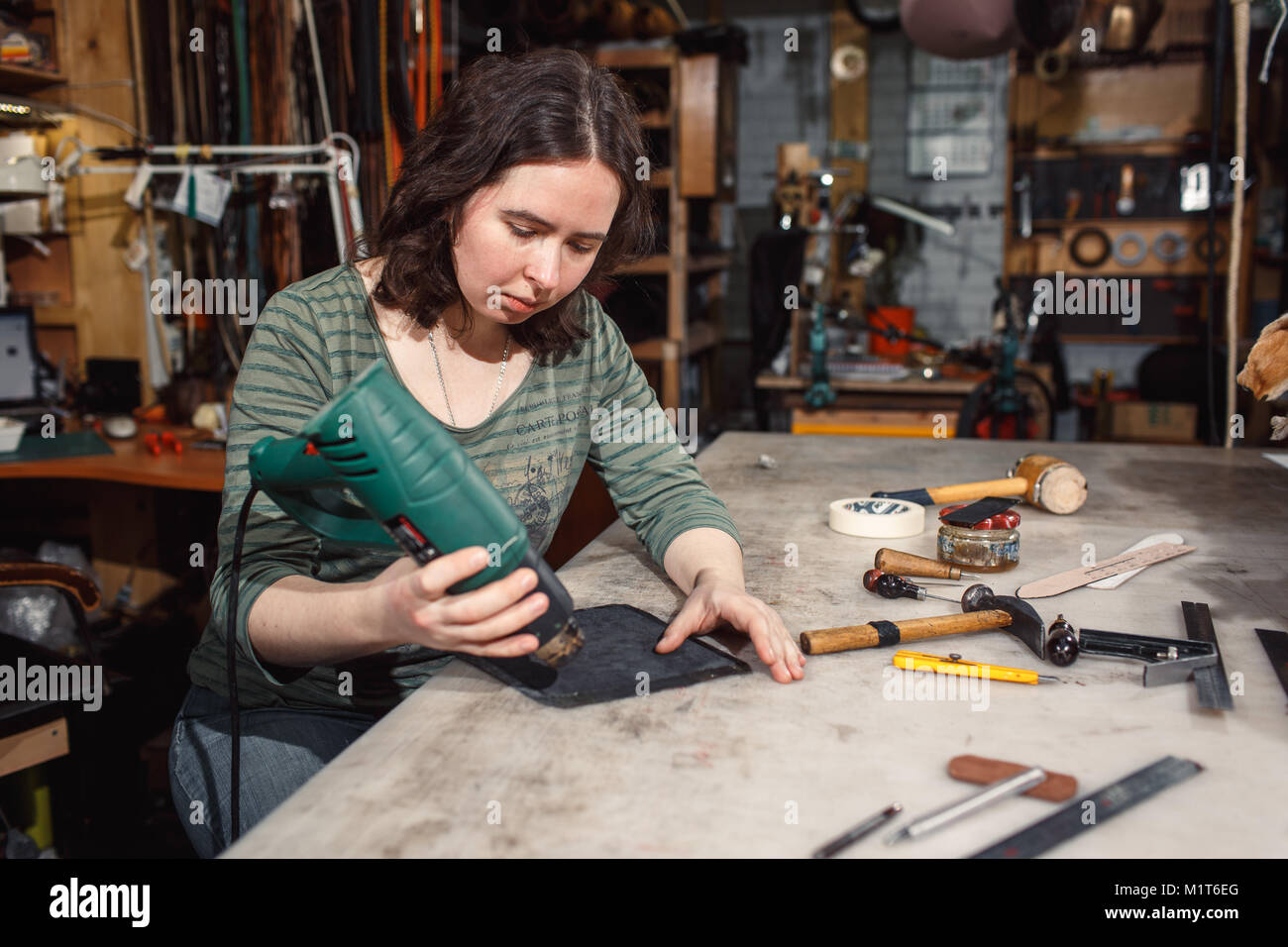 Working process in the leather workshop Stock Photo - Alamy