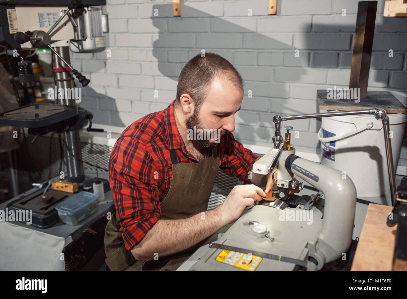 Working process in the leather workshop. Tanner in old tannery Stock ...